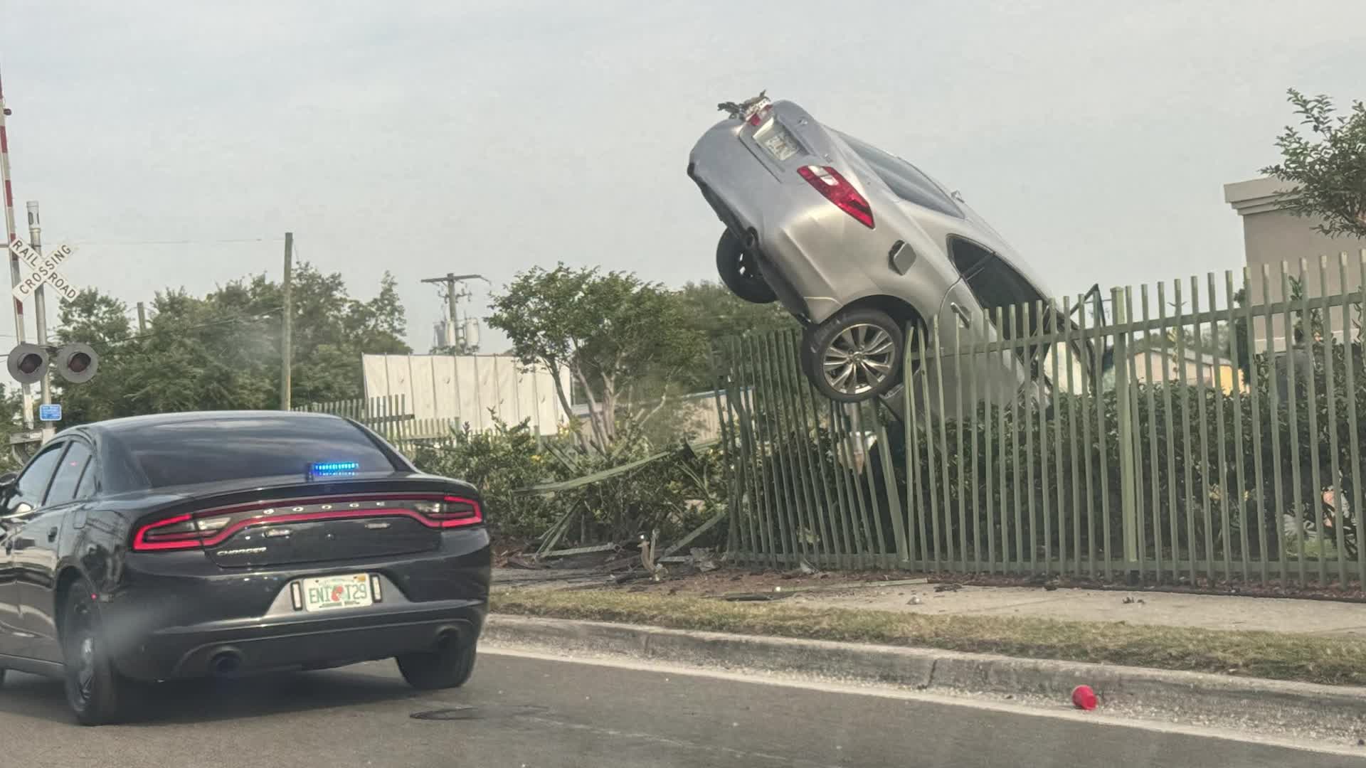 Car on fence near Busch Gardens – WFLA