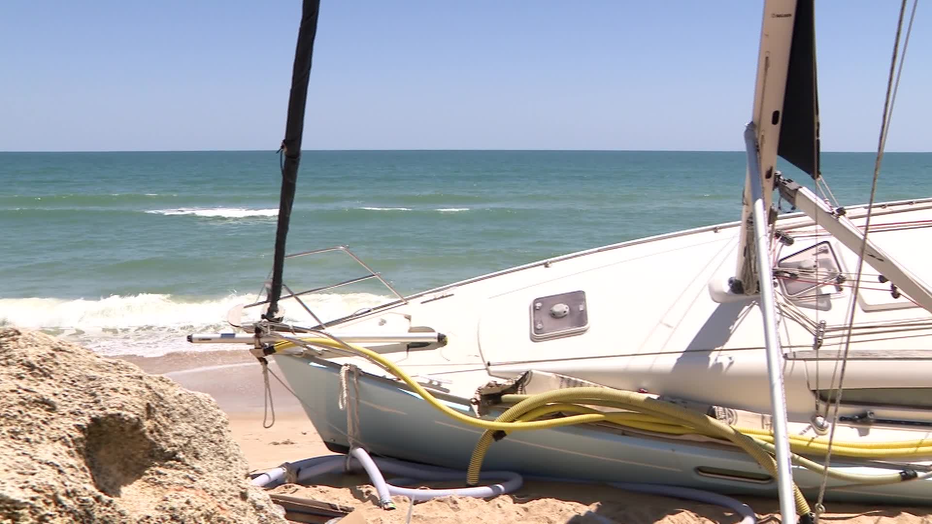 Man living aboard beached boat after washing ashore – WFLA
