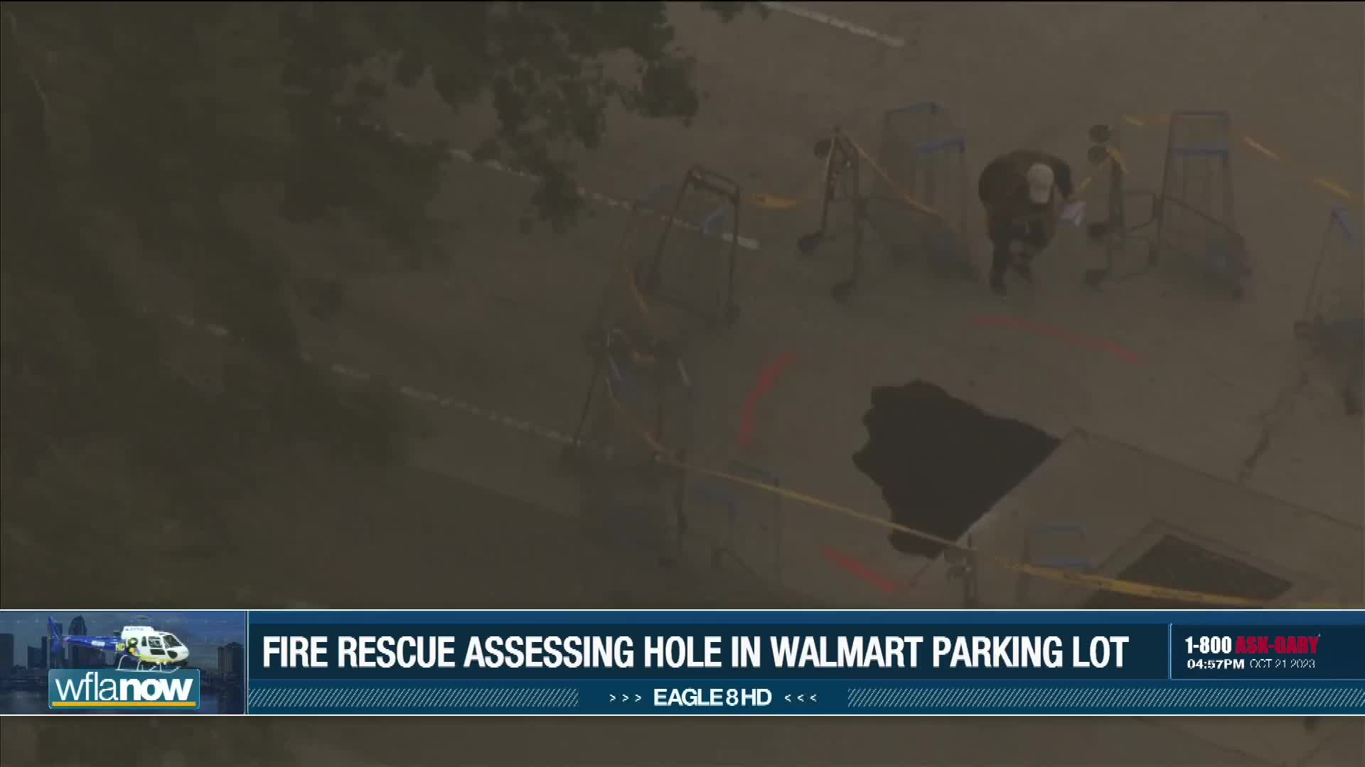 Fire rescue assessing hole in Walmart parking lot in Pasco County – WFLA